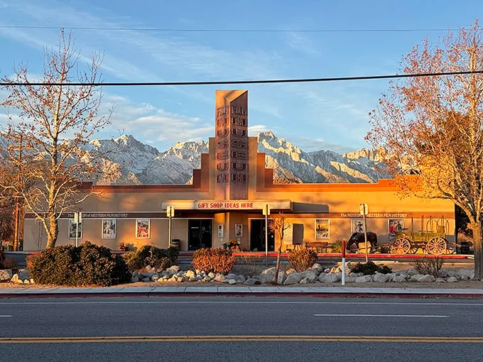 The Museum of Western Film History glows golden in late afternoon light, housing treasures from Hollywood's love affair with these rugged landscapes.