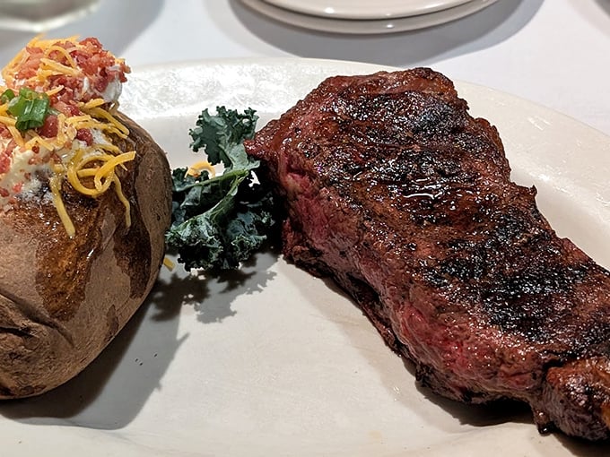 This New York strip has that perfect char that whispers, "I've been kissed by fire just long enough to seal in everything you're dreaming of."