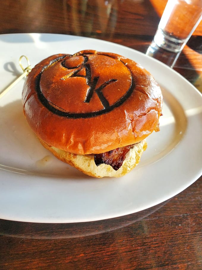 The Oak burger arrives with its logo branded right onto the bun—like a delicious autograph from a celebrity chef who actually knows how to cook.