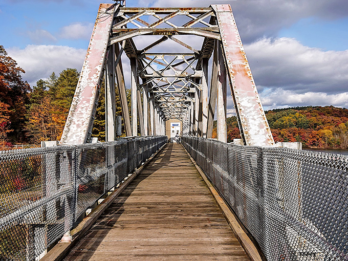 This pedestrian bridge isn't just crossing water—it's spanning decades, connecting modern hikers to the industrial craftsmanship of another era