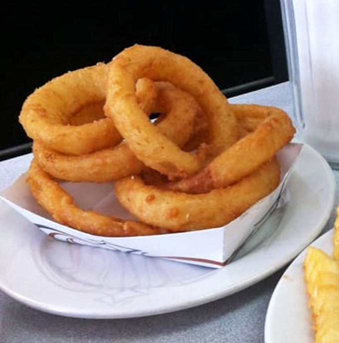 Onion rings with a crunch you can hear across the room—the perfect supporting actor to your burger blockbuster.