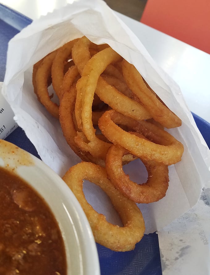 Golden, crispy onion rings that crackle with each bite – the perfect supporting actor to the chili's starring role in this Findlay food drama.
