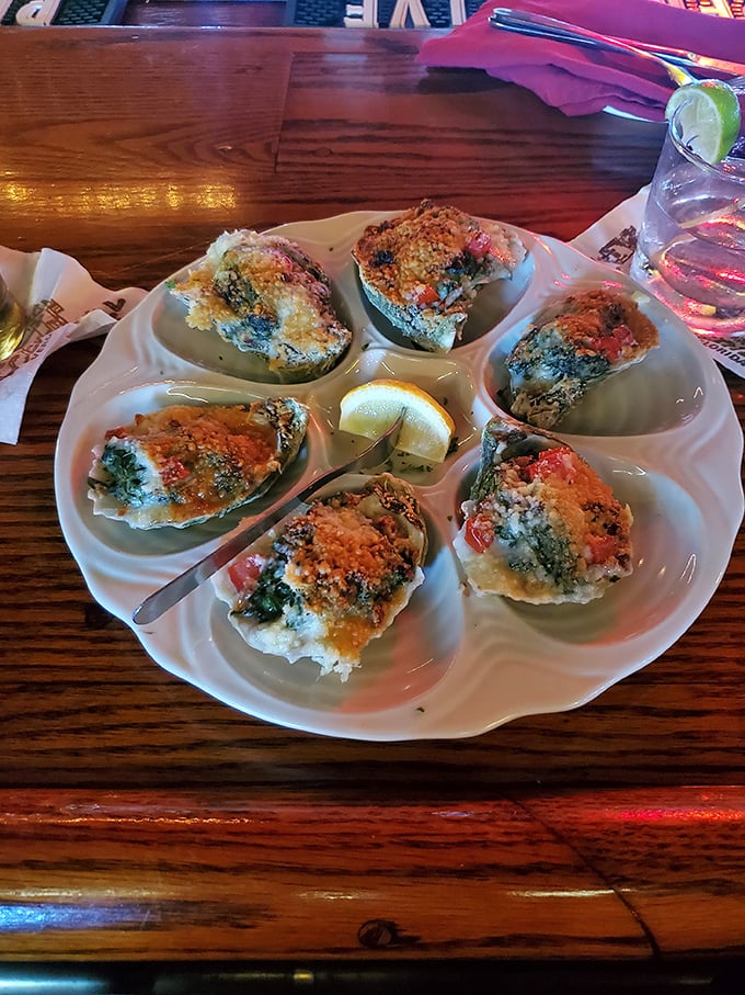 Oysters Rockefeller arrive like jewels on a platter, each one a perfect bite of ocean, butter, and breadcrumbs that would make the Rockefellers themselves jealous.