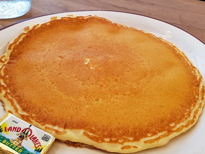 The pancake that launched a thousand diets – and broke them all. Golden, buttery perfection that makes you forget fancy brunches ever existed.