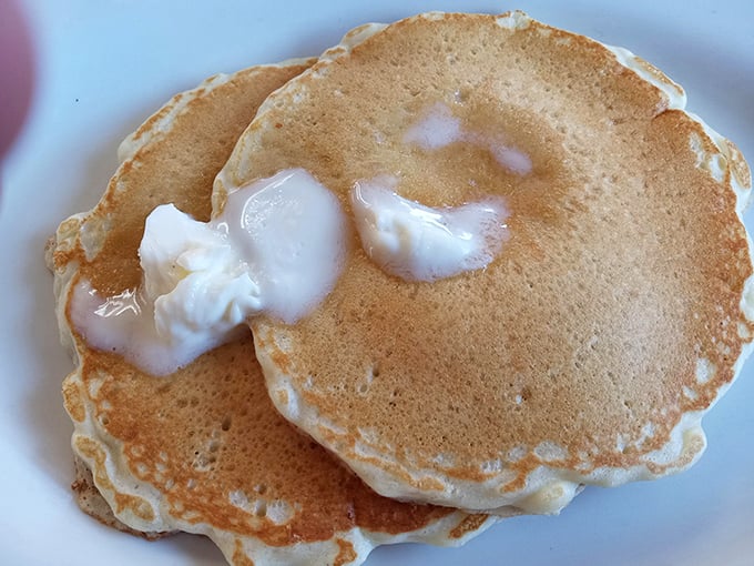 These pancakes aren't just breakfast; they're edible sunshine that somehow manages to be both fluffy and substantial simultaneously.