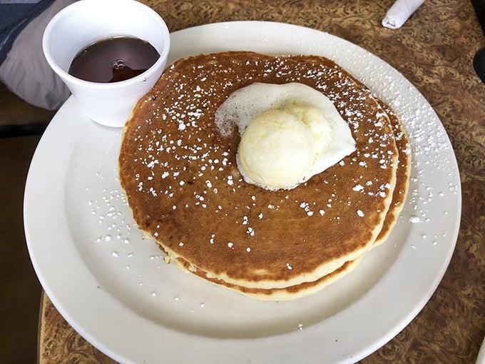 The pancake that launched a thousand diets—and broke them all. That scoop of butter melting into golden perfection is breakfast's siren song.