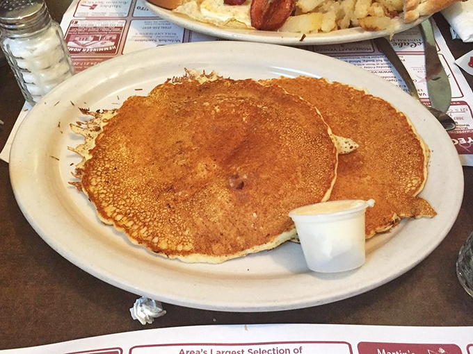Pancakes that extend beyond their plate's boundaries—a delicious rebellion against portion control that would make your grandmother proud.