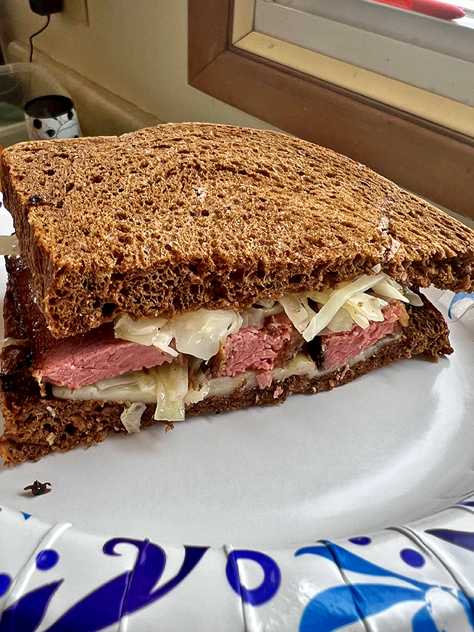 This isn't just a sandwich; it's architecture with flavor. Layers of pastrami, sauerkraut, and cheese between rye create the skyscraper of satisfaction.