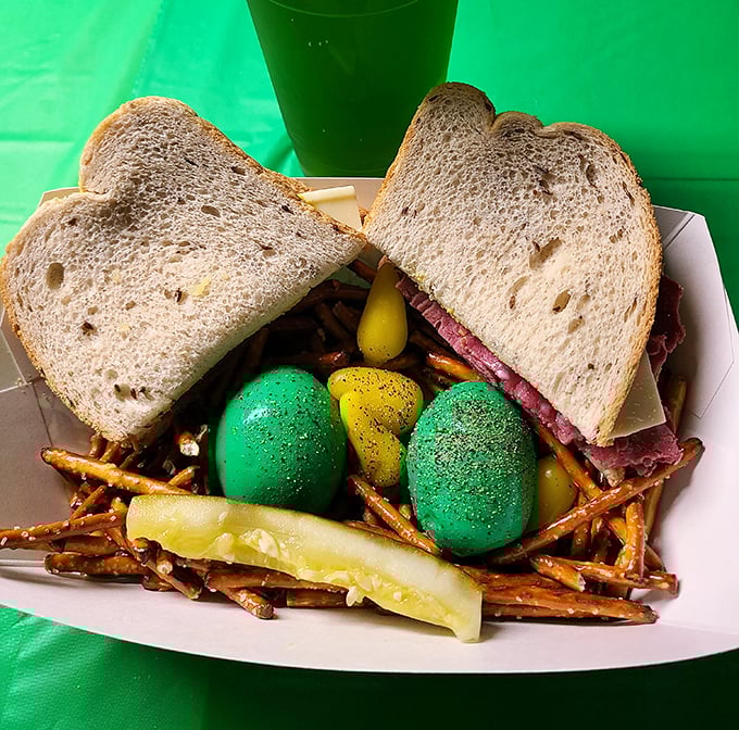 A sandwich and pretzels nestled together like old friends at a reunion, with those distinctive colored eggs adding a pop of whimsy that screams "Joe Jost's tradition."