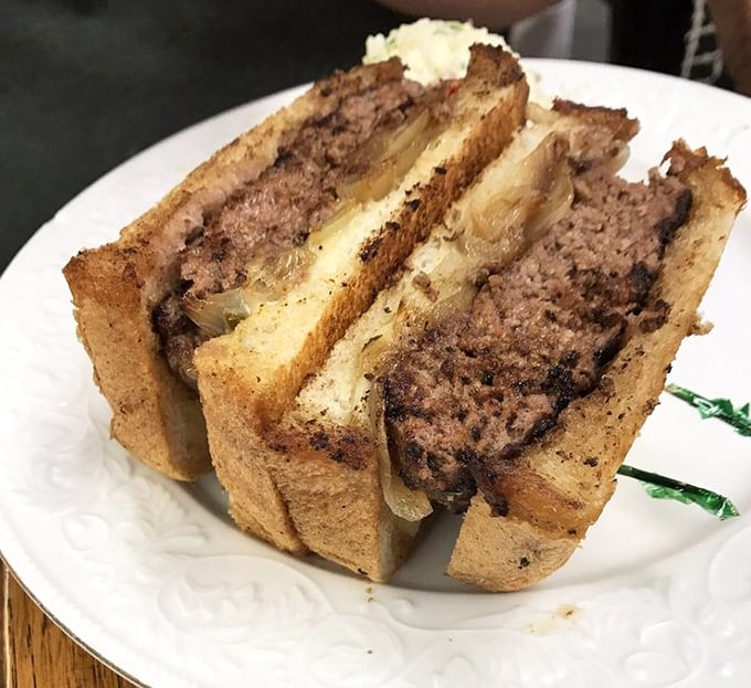 This patty melt doesn't need dating apps—it's already found its perfect match with grilled onions and melted cheese between toasty bread.