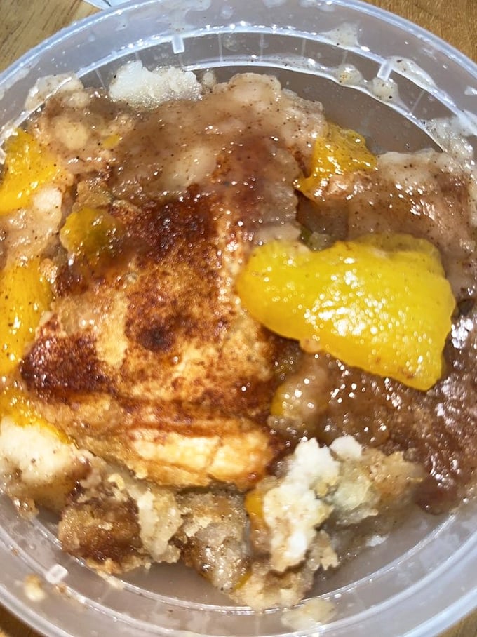 Peach cobbler looking like summer decided to stick around—fruity, golden, and absolutely worth the extra unbuttoned notch.