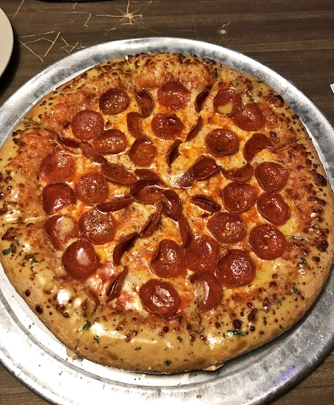 A pepperoni pizza that respects tradition while quietly perfecting it—crispy-edged pepperoni creating little flavor pools that pizza aficionados dream about.