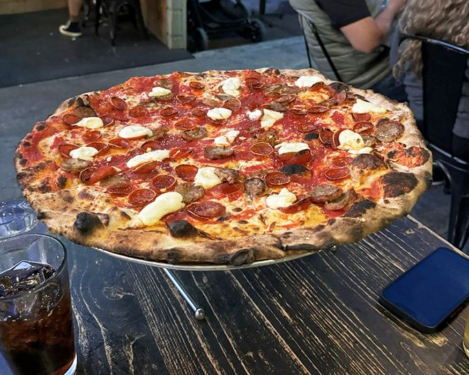 Pizza perfection doesn't need to shout—it speaks in the language of perfectly charred crust, melty cheese, and pepperoni cups that cradle tiny pools of flavor.