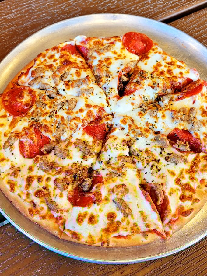 Pizza that strikes the perfect balance between artisanal craft and down-home comfort—where pepperoni and cheese unite in a harmony sweeter than a Dolly Parton chorus.