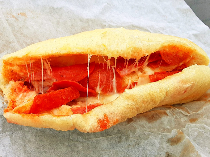 The legendary pepperoni roll in all its glory – where pillowy dough meets spicy pepperoni in a relationship more perfect than any Hollywood romance.