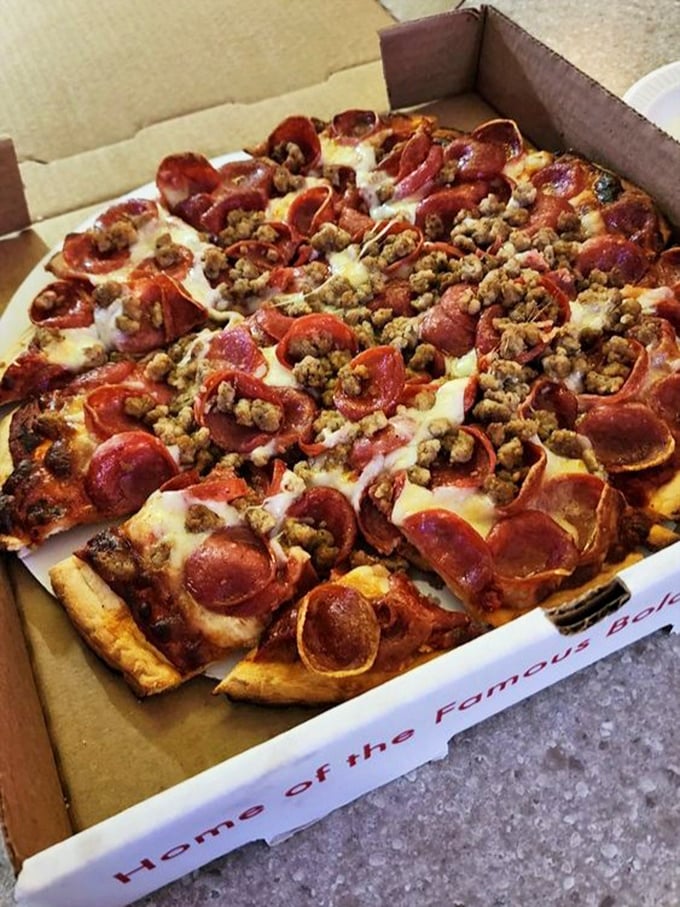 Even their pizza refuses to be ordinary – loaded with pepperoni and sausage that would make an Italian grandmother nod in approval.