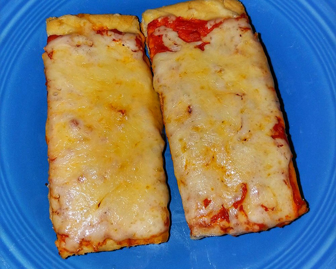 Old Forge's famous rectangular pizza – where cheese meets sauce in a geometric relationship that somehow makes more sense than most modern romances. 
