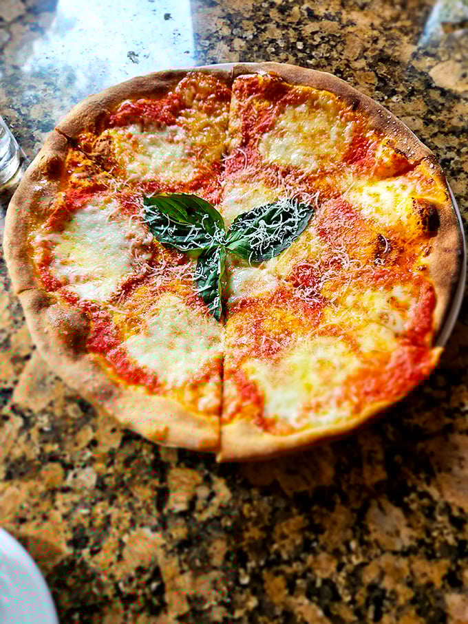 Pizza margherita so authentic you'll check your passport—that char on the crust is the kiss from a properly hot oven.