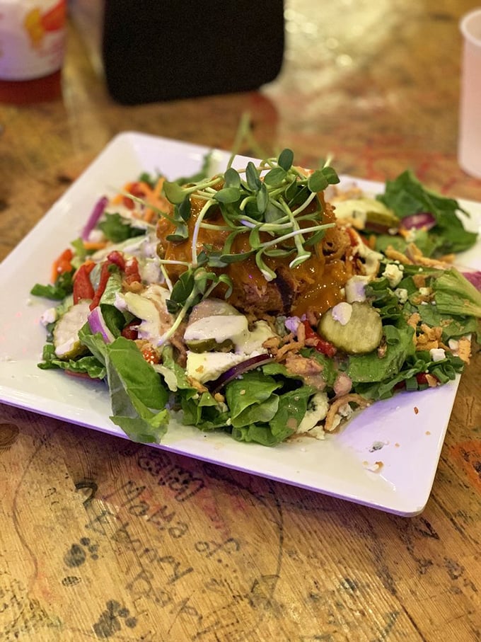 Not just a token salad—this vibrant creation proves vegetables can hang with the big meats. The pulled pork crown turns a healthy choice into a celebration.