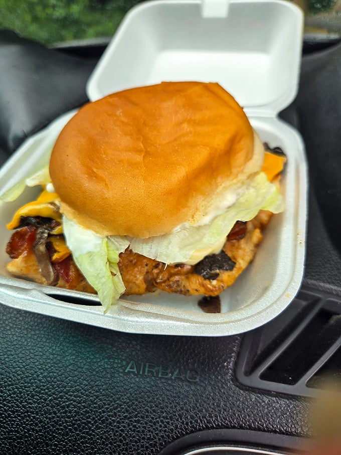 A sandwich that requires both hands and your full attention. Layers of flavor nestled between soft buns—comfort food engineering at its finest.