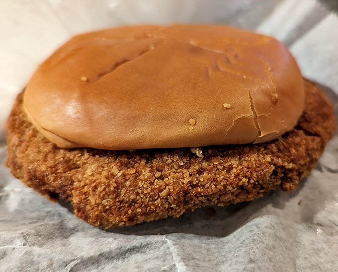 The legendary pork tenderloin – golden-brown perfection that laughs at the concept of bun-to-meat ratio. Indiana's edible badge of honor.