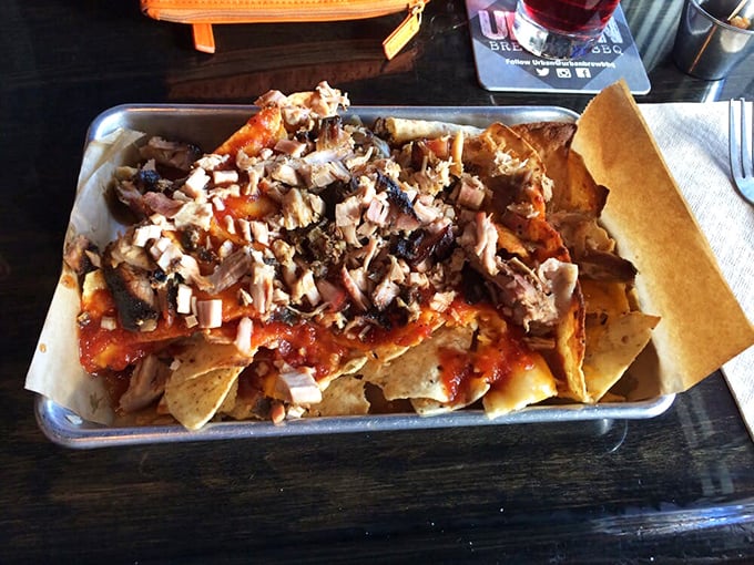 BBQ nachos that laugh in the face of restraint – a glorious mess of chips, cheese, and smoky meat that demands to be shared but tempts you not to.