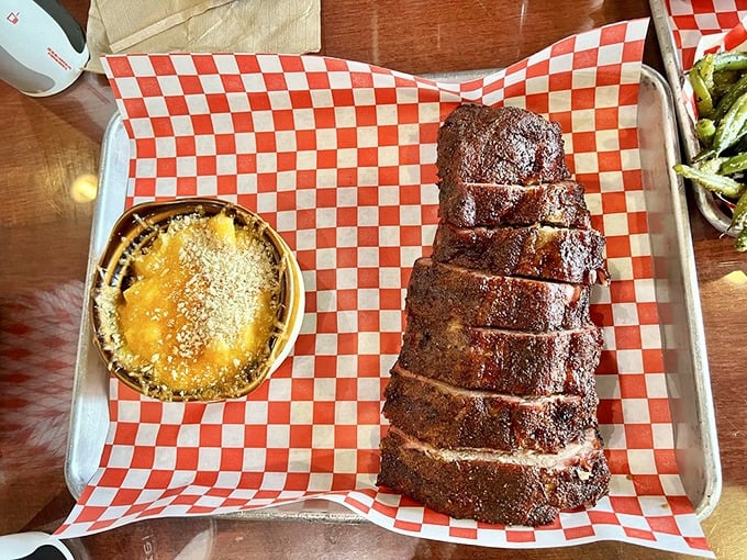 Meat and mac in perfect harmony—like Sinatra and a good bourbon. The ribs' glistening exterior promises a flavor explosion that delivers with every bite.