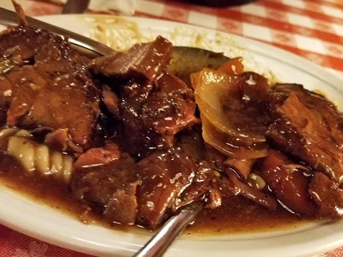 This pot roast didn't just fall off the bone – it surrendered with dignity after hours of slow-cooking. Fork-tender evidence that patience is delicious.