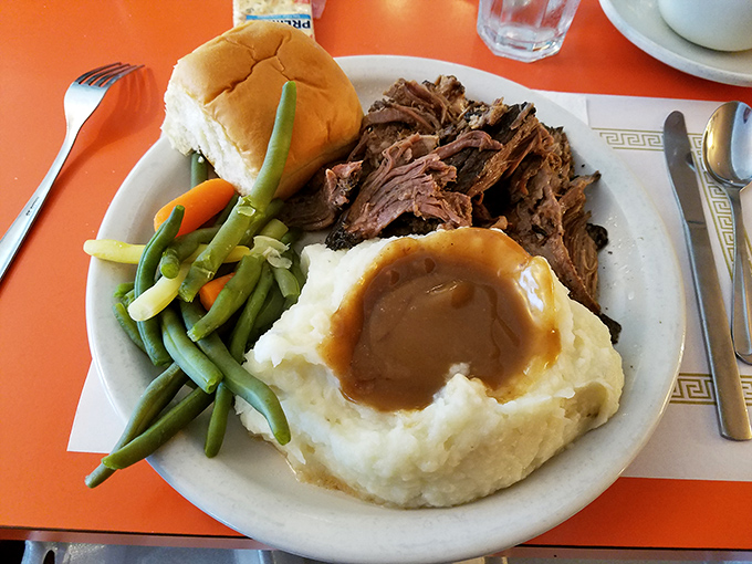 Pot roast that doesn't need a filter – fork-tender meat, cloud-like mashed potatoes with a gravy lake, and vegetables your mother would approve of.