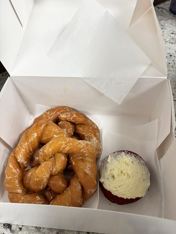 The twisted perfection of Bill's glazed pretzel alongside a cream-filled masterpiece. Some people frame art; I prefer to eat it.