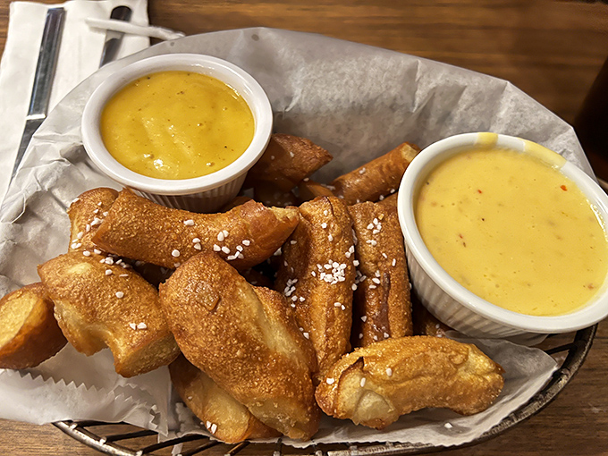 These golden pretzel nuggets aren't just appetizers—they're doughy ambassadors of joy, complete with dipping sauces that demand to be explored.