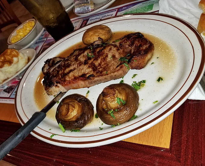 A steak that would make carnivores weep tears of joy. Those mushrooms aren't just along for the ride – they're essential co-stars in this meaty drama.