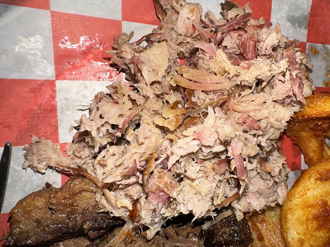 Pulled pork that's actually been pulled, not pulverized. Each strand maintains its dignity while collectively creating a mountain of smoky perfection.