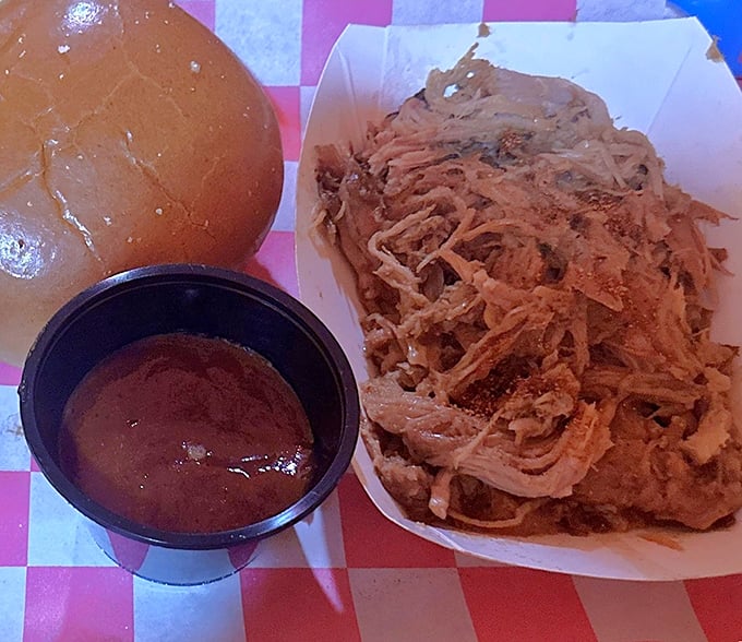 Pulled pork so tender it practically pulled itself—paired with sauce that doesn't know the meaning of "subtle."