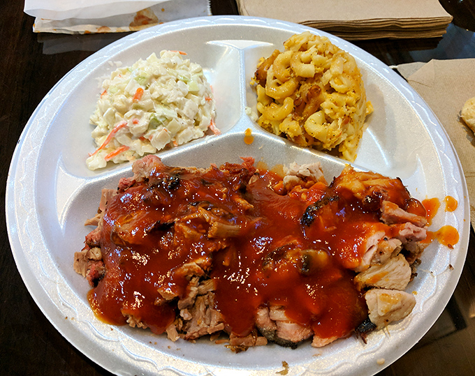 Pulled pork so tender it practically surrenders to your fork, flanked by coleslaw that cuts through the richness perfectly.