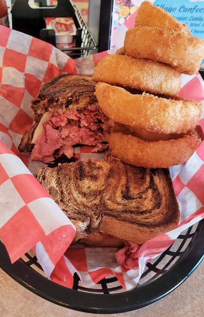 This Reuben isn't just a sandwich—it's architecture. The perfect ratio of corned beef to kraut, all nestled between marble rye like the world's most delicious layer cake.