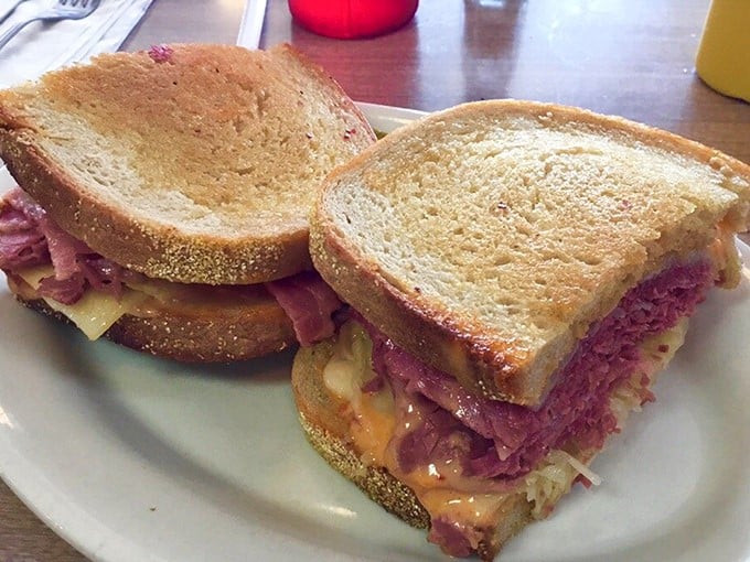 This isn't just a sandwich; it's architecture. Layers of corned beef, sauerkraut, and melted cheese creating the Taj Mahal of Reubens on perfectly toasted rye.