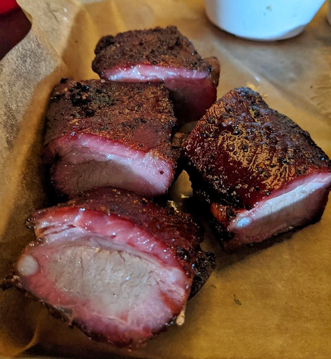 These rib tips showcase that magical bark-to-meat ratio that barbecue dreams are made of—each bite a textural adventure between crispy exterior and tender interior.