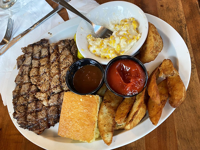 This ribeye has the kind of char that makes other steaks jealous. Paired with golden potato wedges and cornbread, it's the carnivore's dream team.