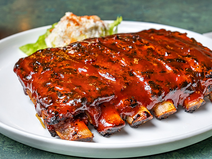 These ribs glisten with sauce like they're dressed for a night on the town – absolutely irresistible.