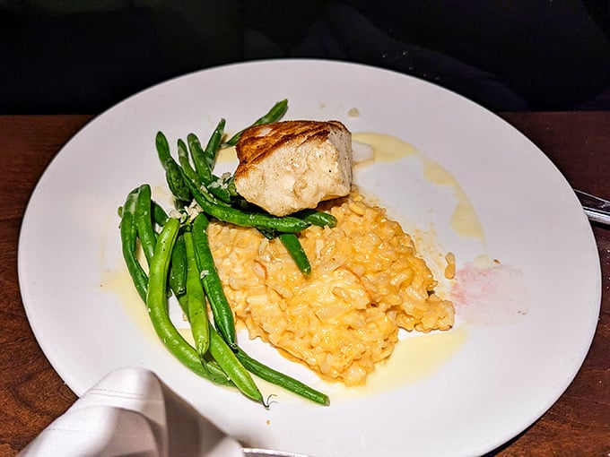 Simple perfection on a plate: tender fish, vibrant green beans, and risotto that would make an Italian grandmother nod in approval.