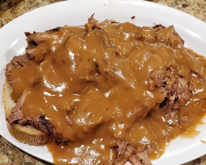 This open-faced roast beef sandwich isn't just comfort food – it's a warm hug from your grandmother if she had a PhD in gravy-making.