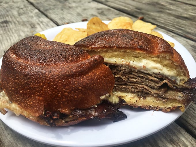 This isn't just a sandwich—it's architecture. Layers of house-roasted beef stacked with precision that would make Frank Lloyd Wright nod in approval.