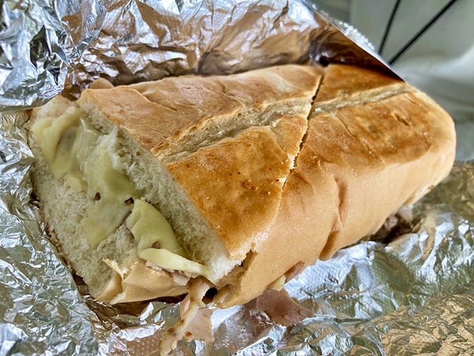 The Pan con Lechón showcases slow-roasted pork in all its glory, a testament to patience being the secret ingredient in truly transcendent sandwiches.
