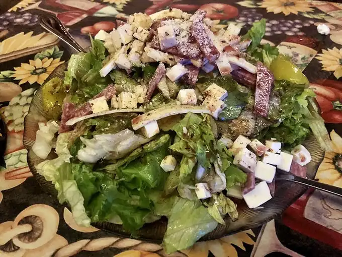 A salad that actually deserves respect, not just obligation. Crisp greens and generous toppings prove vegetables can hang with the heavy hitters.