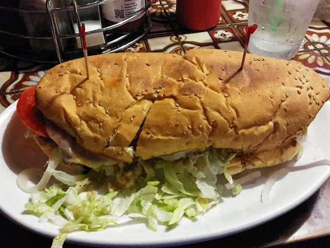 This isn't just a sandwich; it's an architectural marvel of meat, cheese, and veggies that requires both hands and a strategy.
