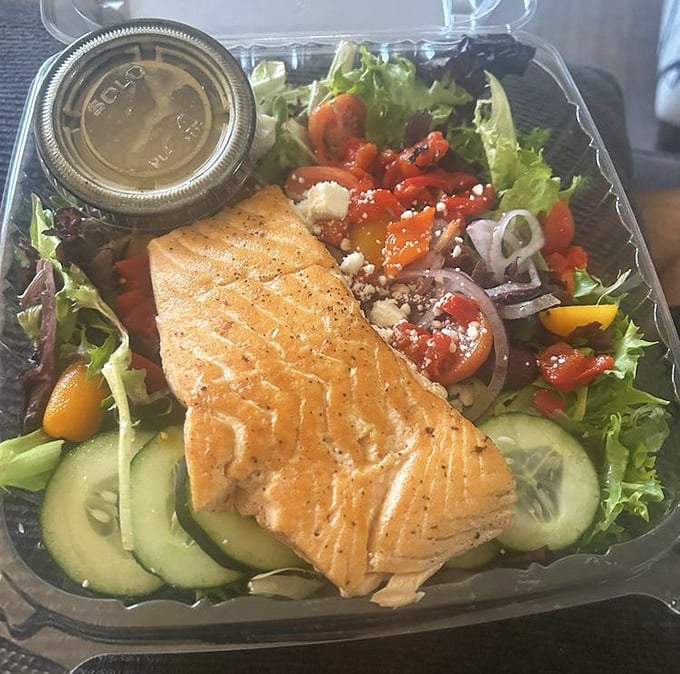 Not all heroes wear capes – some come as perfectly grilled salmon atop a garden of fresh vegetables that make eating healthy feel like cheating.