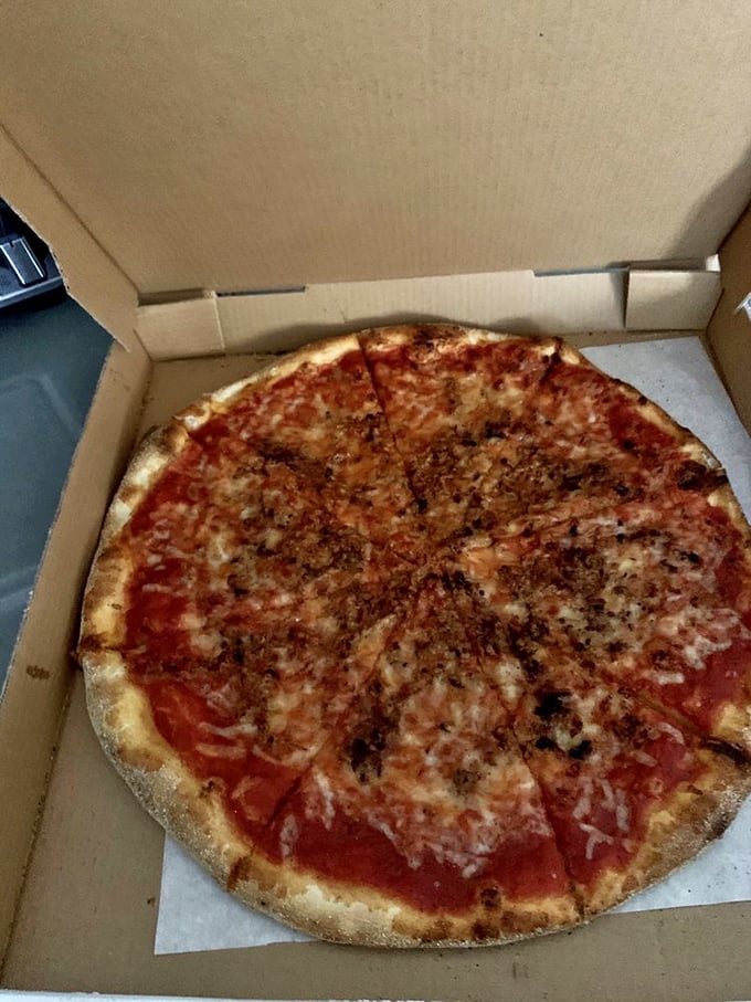 This sausage-topped masterpiece proves that sometimes the simplest combinations create the most profound flavors. No Instagram filter required for this beauty.