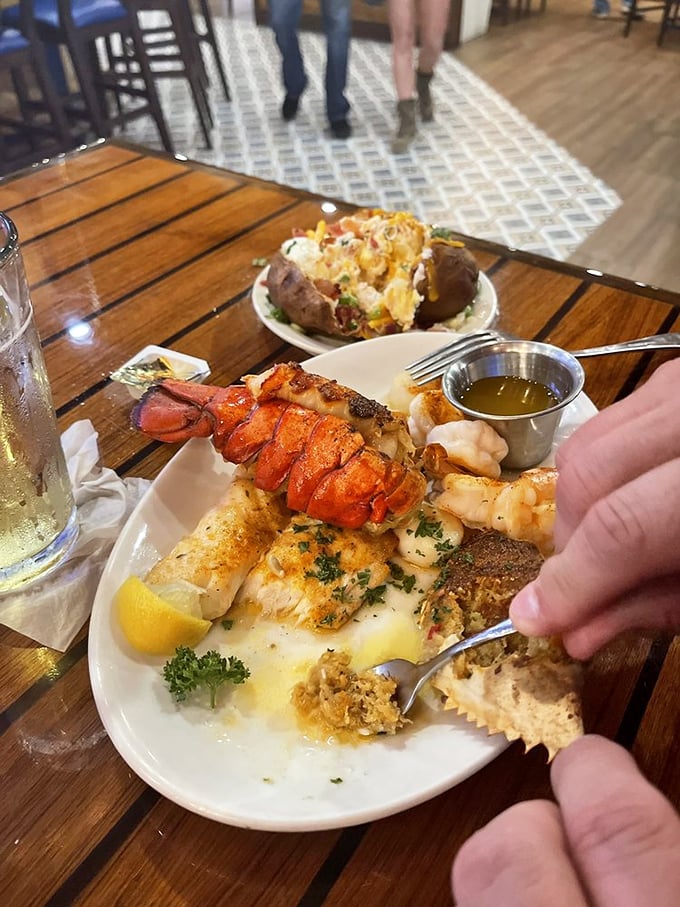 The seafood platter that launches a thousand road trips—lobster tail, fish, and all manner of treasures from the deep, arranged like edible jewelry.