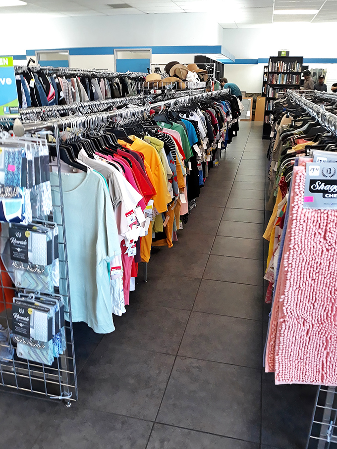 A rainbow of possibilities hanging in neat rows. That yellow tee could be your next favorite "I can't believe it was only $4" story.